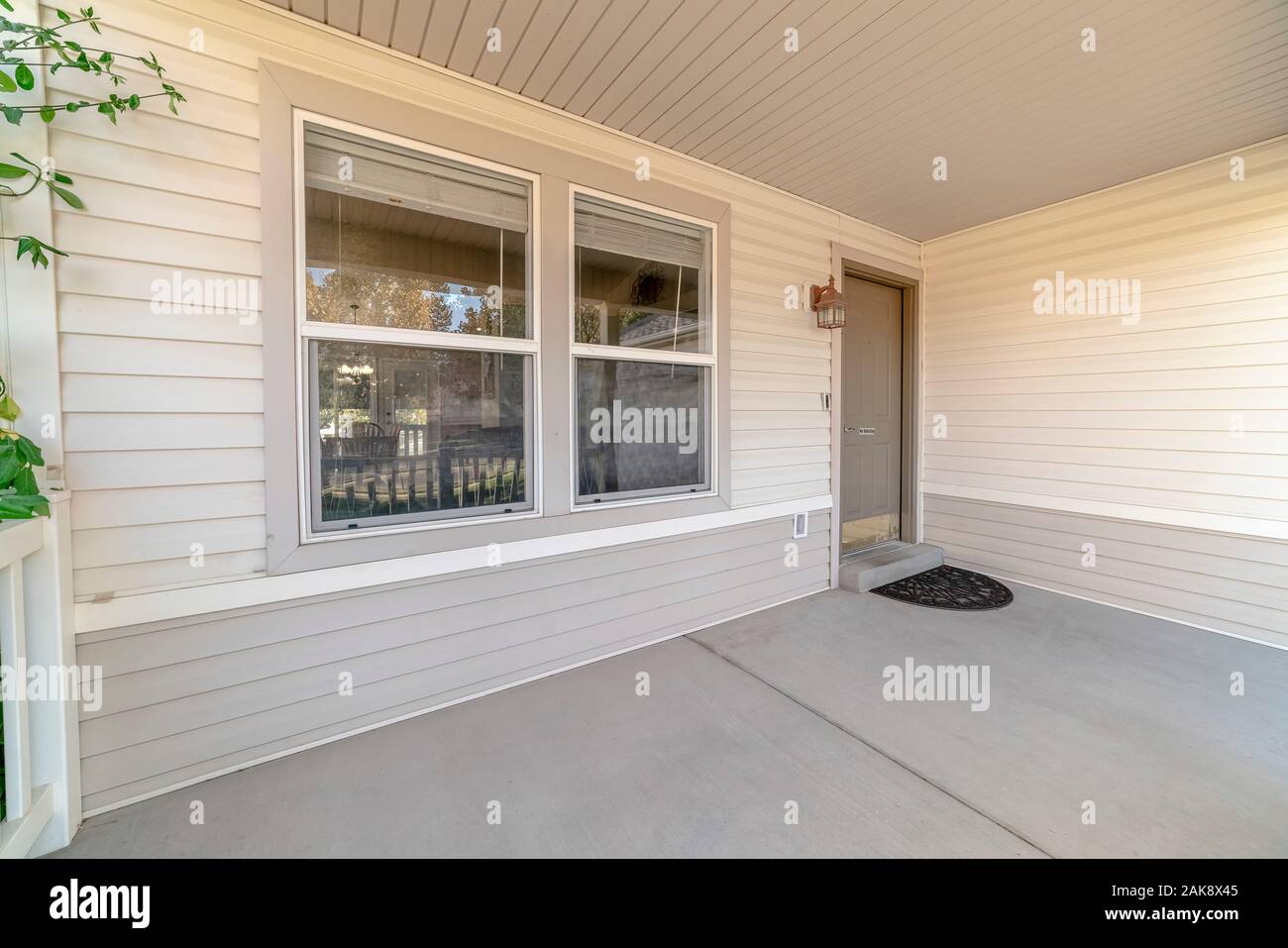 Covered entrance porch and door to a house Stock Photo - Alamy