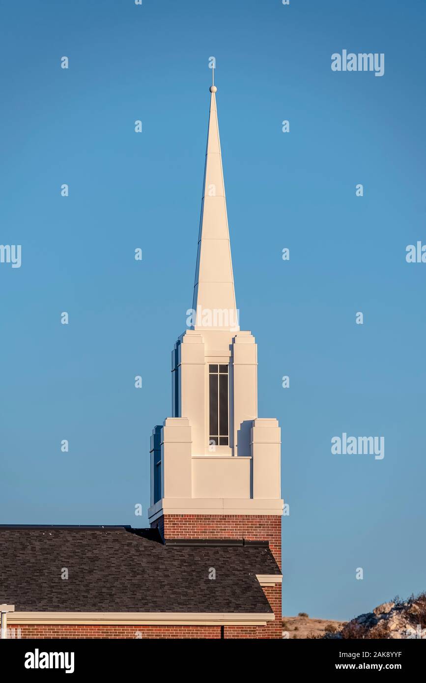 Modern white church steeple or spire near sunrise Stock Photo - Alamy
