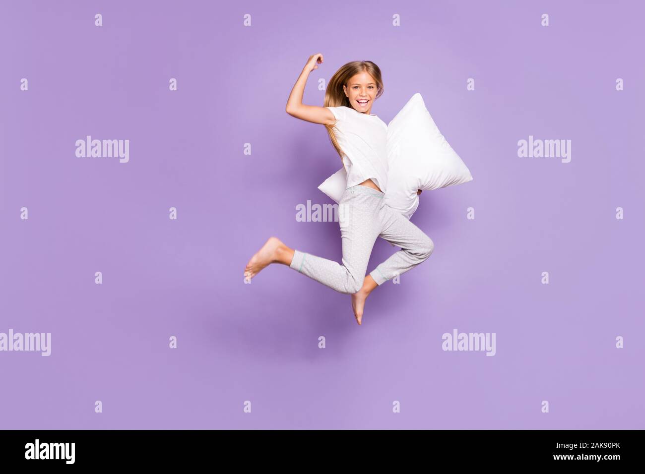 I win pillow fight game. Full body photo of funny funky blonde hair ...