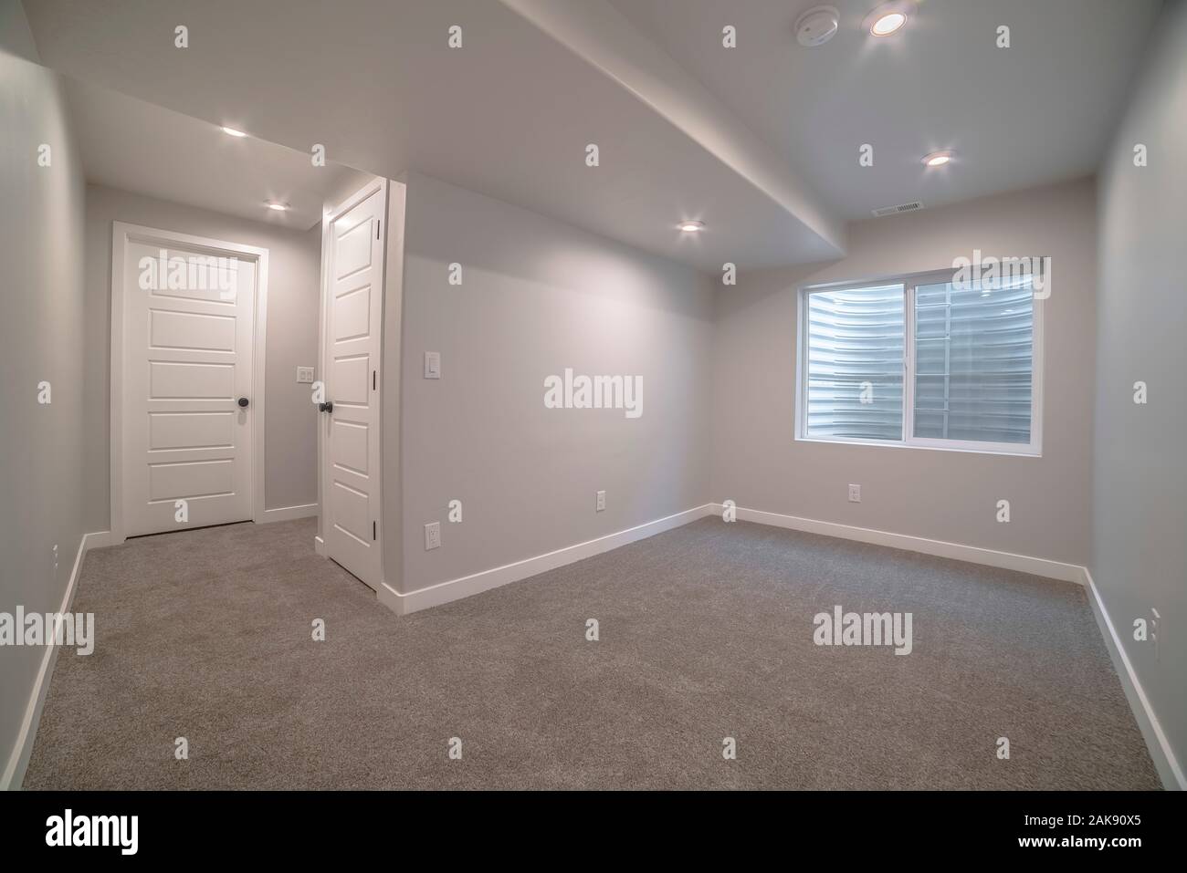 Empty living room interior with beige walls Stock Photo - Alamy