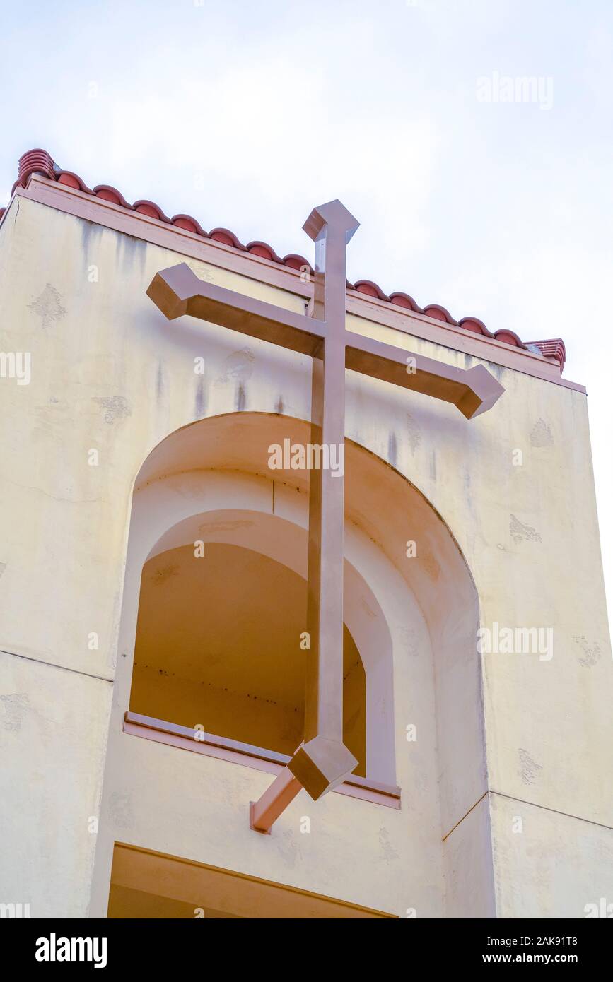 Cross mounted to the exterior of a church tower Stock Photo - Alamy
