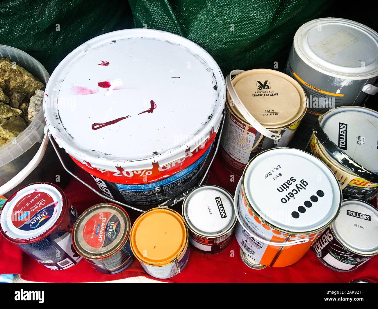 Paint buckets to recycle, stocked in a car trunk, Lyon, France Stock ...