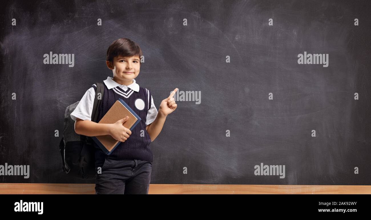 Boy pointing at book hi-res stock photography and images - Alamy