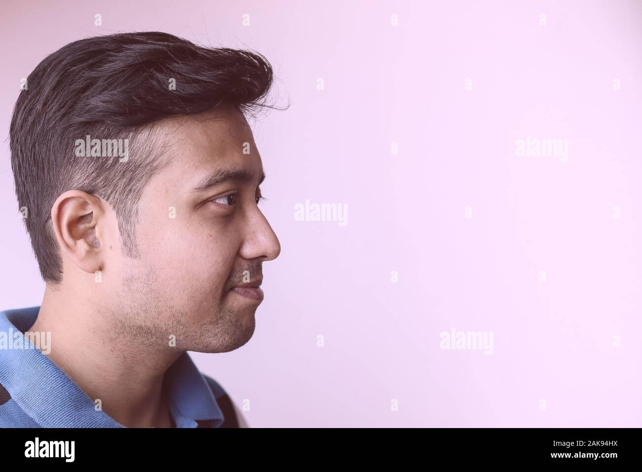 side face of a young indian male model isolated in white background ...