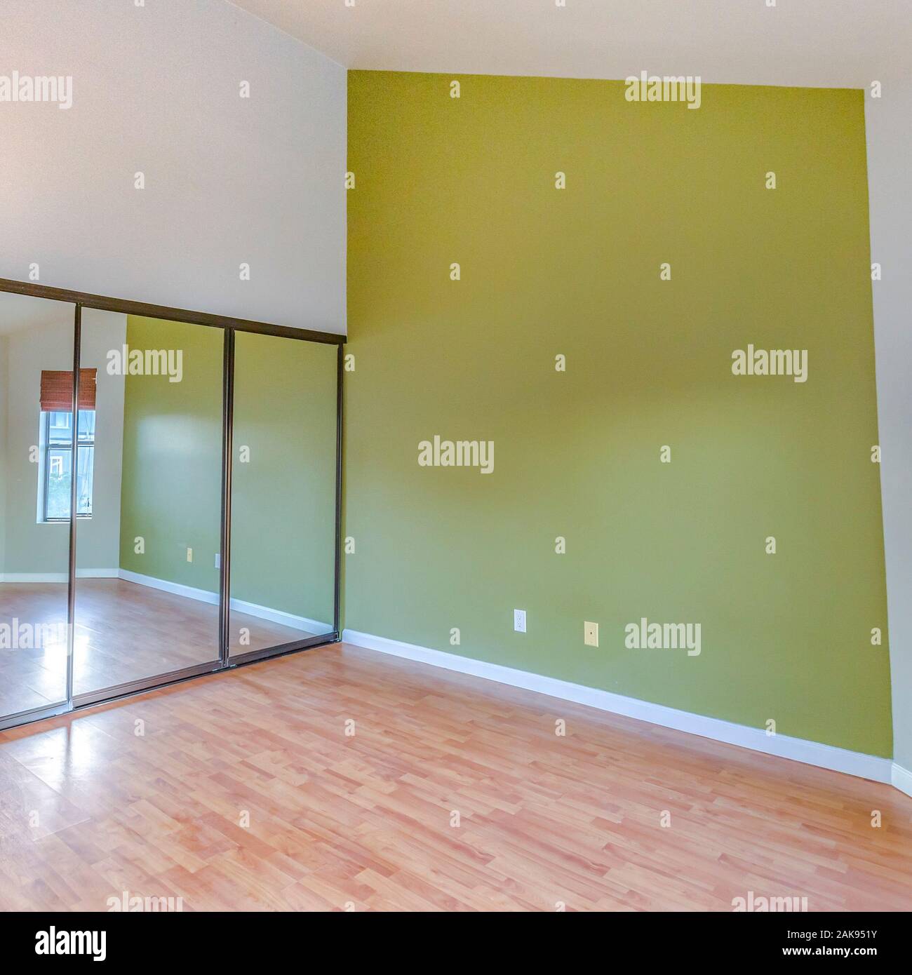 Square Empty master bedroom with wood floor Stock Photo - Alamy