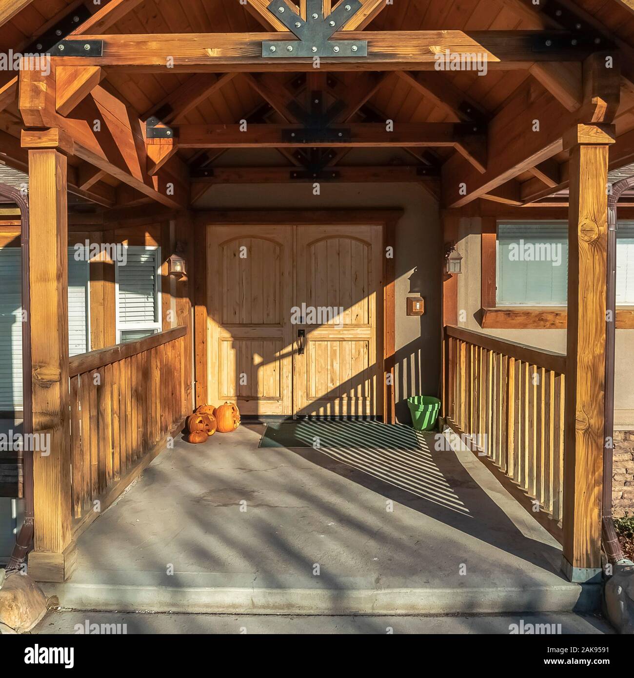 Square Covered wooden entrance portico to a house Stock Photo - Alamy
