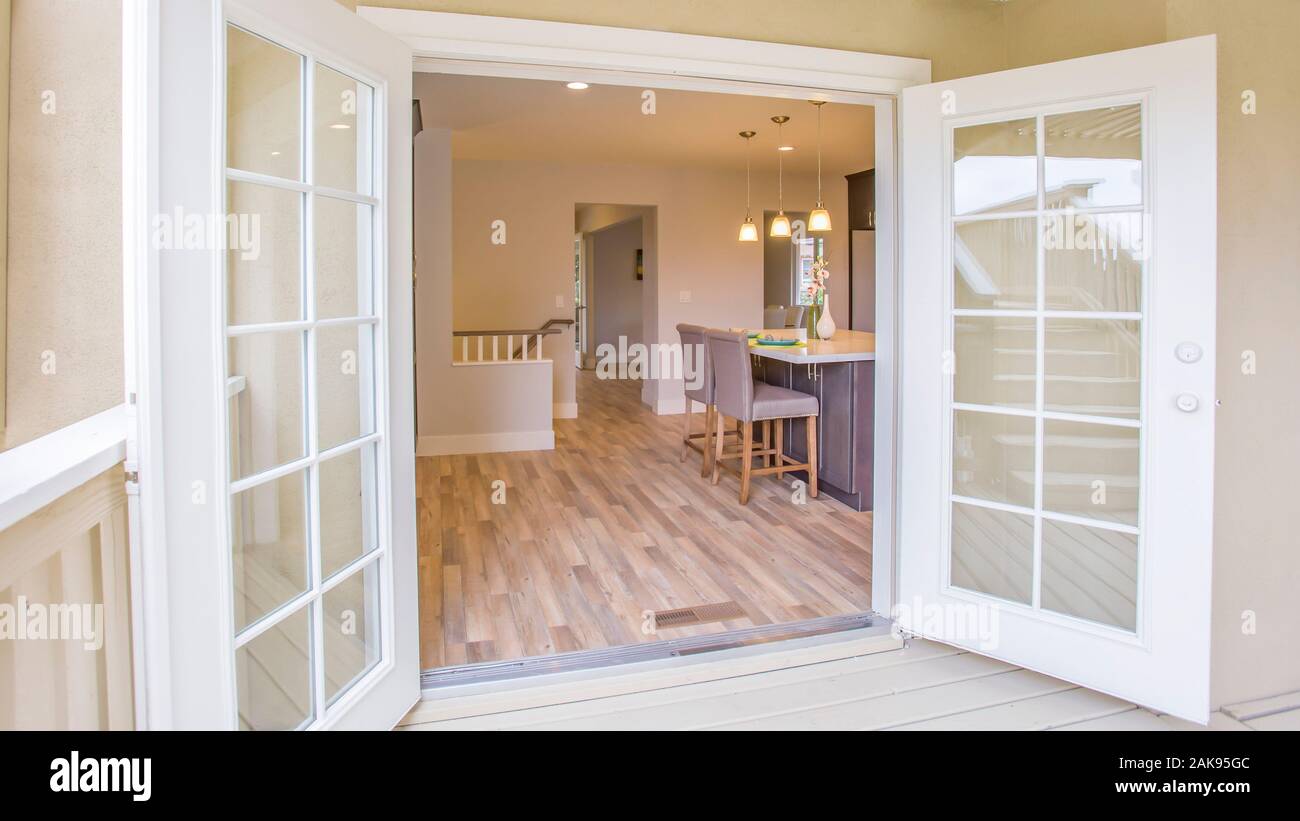 Panorama frame Wide open doors to the kitchen Stock Photo - Alamy