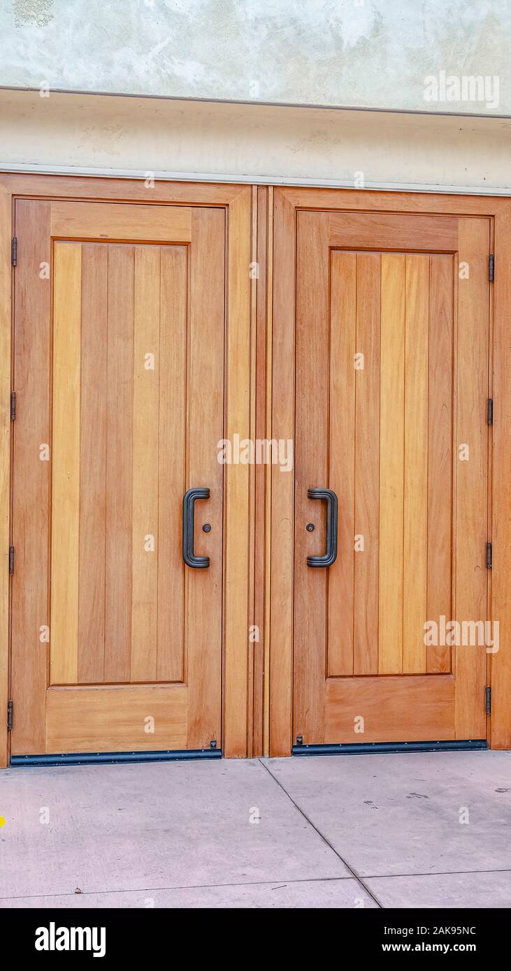 Vertical frame Closed double wooden entrance doors on cloudy day Stock ...