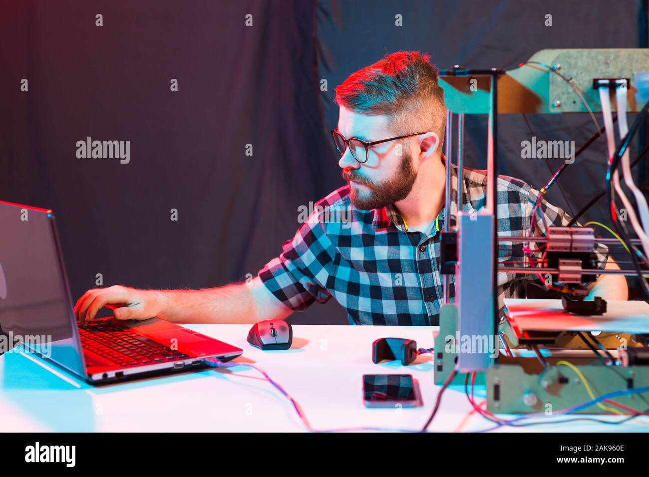 Technology and engineering concept - Male engineer working at night in ...