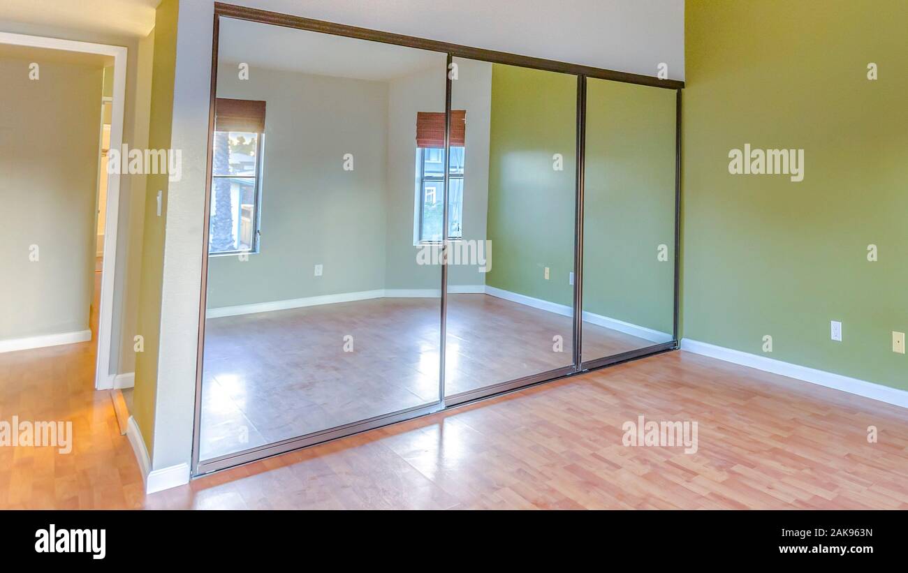 Panorama frame Empty master bedroom with wood floor Stock Photo - Alamy