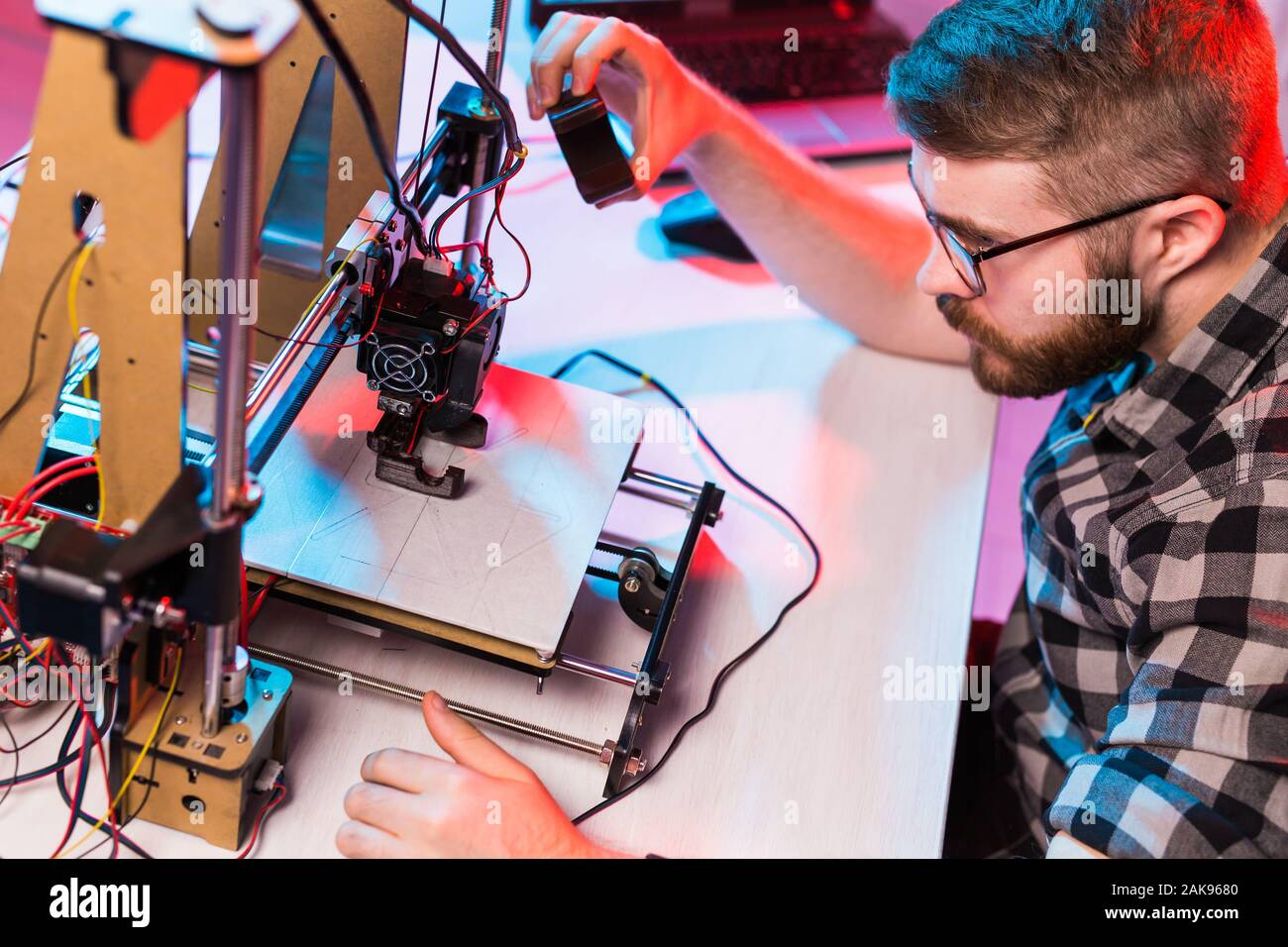Male architect using 3D printer in office Stock Photo - Alamy