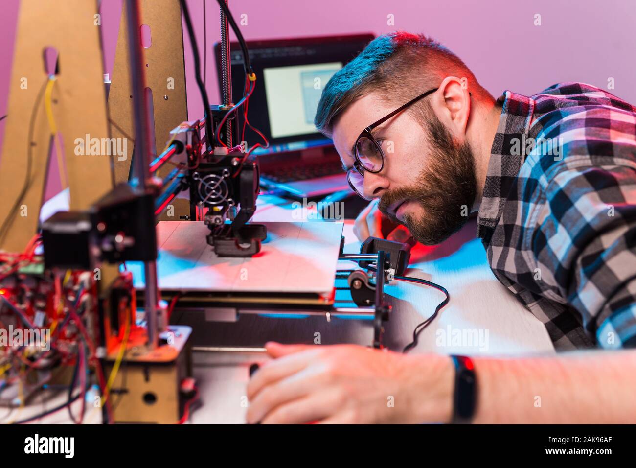 Male architect using 3D printer in office Stock Photo - Alamy