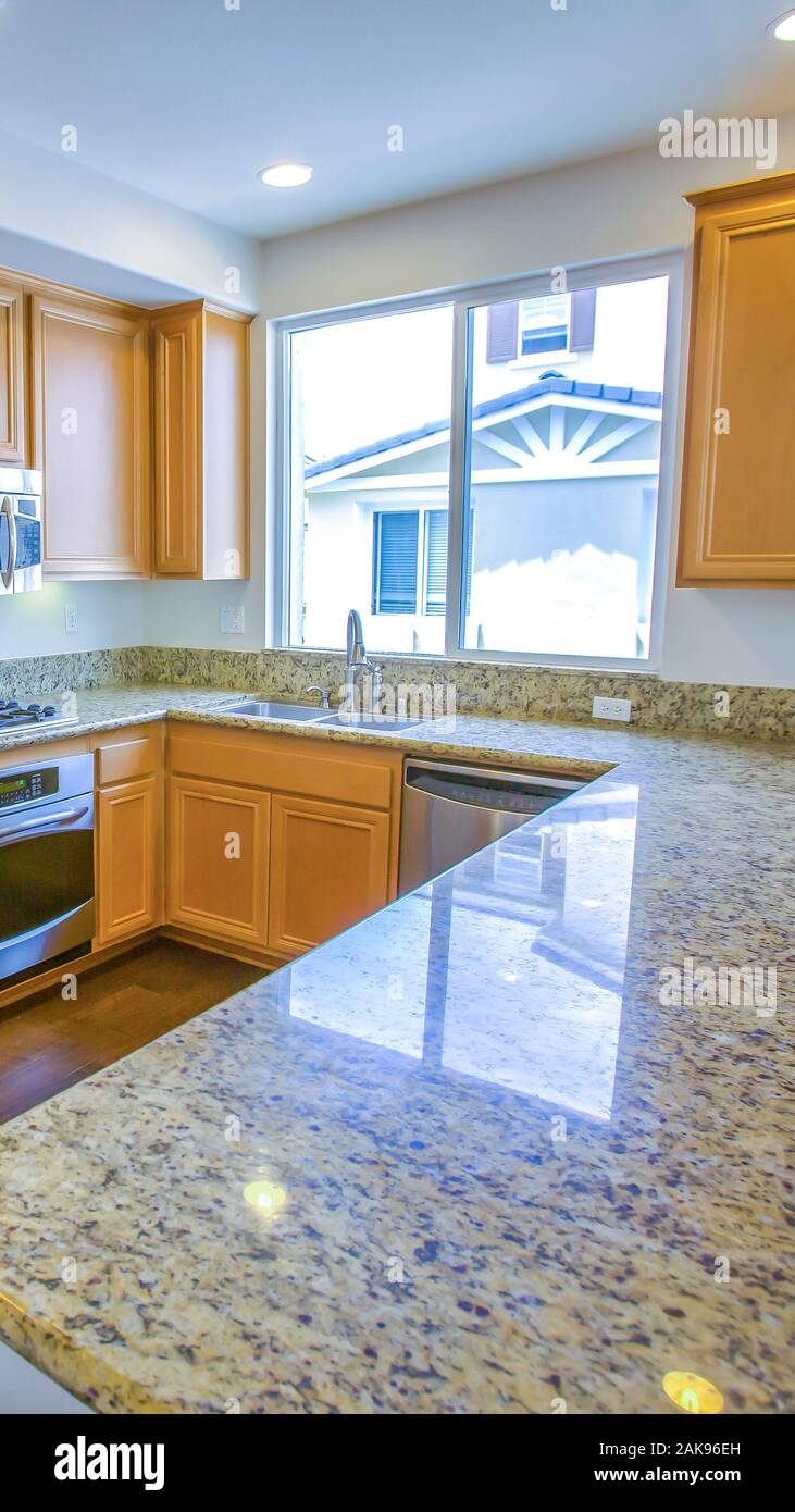 Vertical Lots of granite counter space in this kitchen Stock Photo - Alamy
