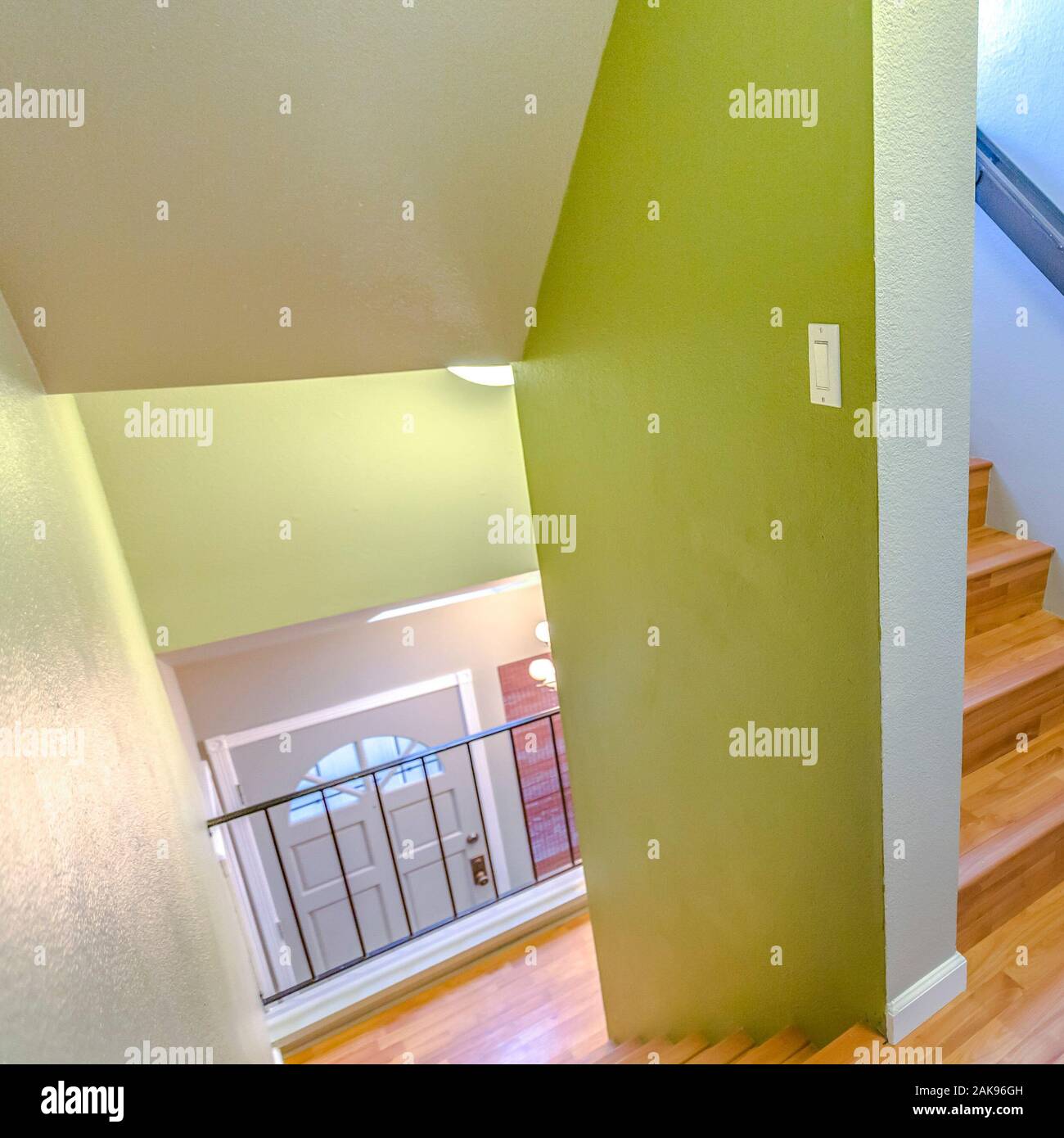 Square frame stairs split between a hallway Stock Photo - Alamy