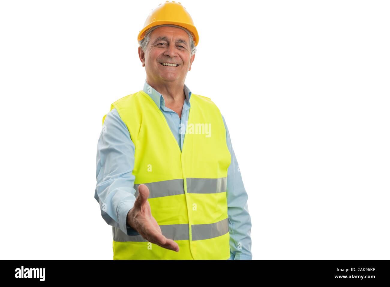Old builder man with friendly expression offering handshake as greeting ...