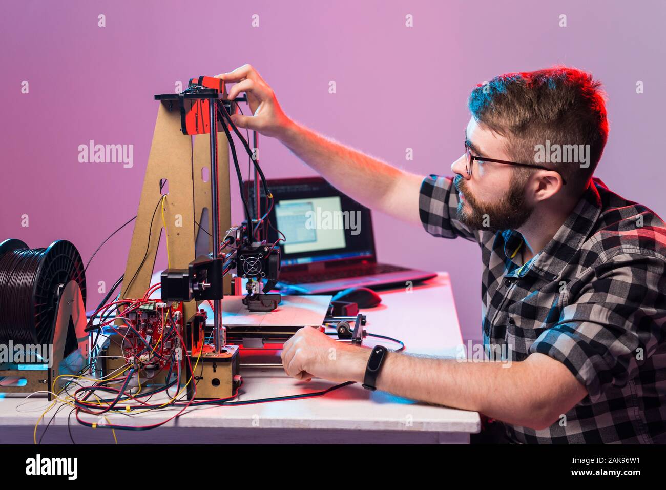 A student man print prototype on 3D printer Stock Photo - Alamy