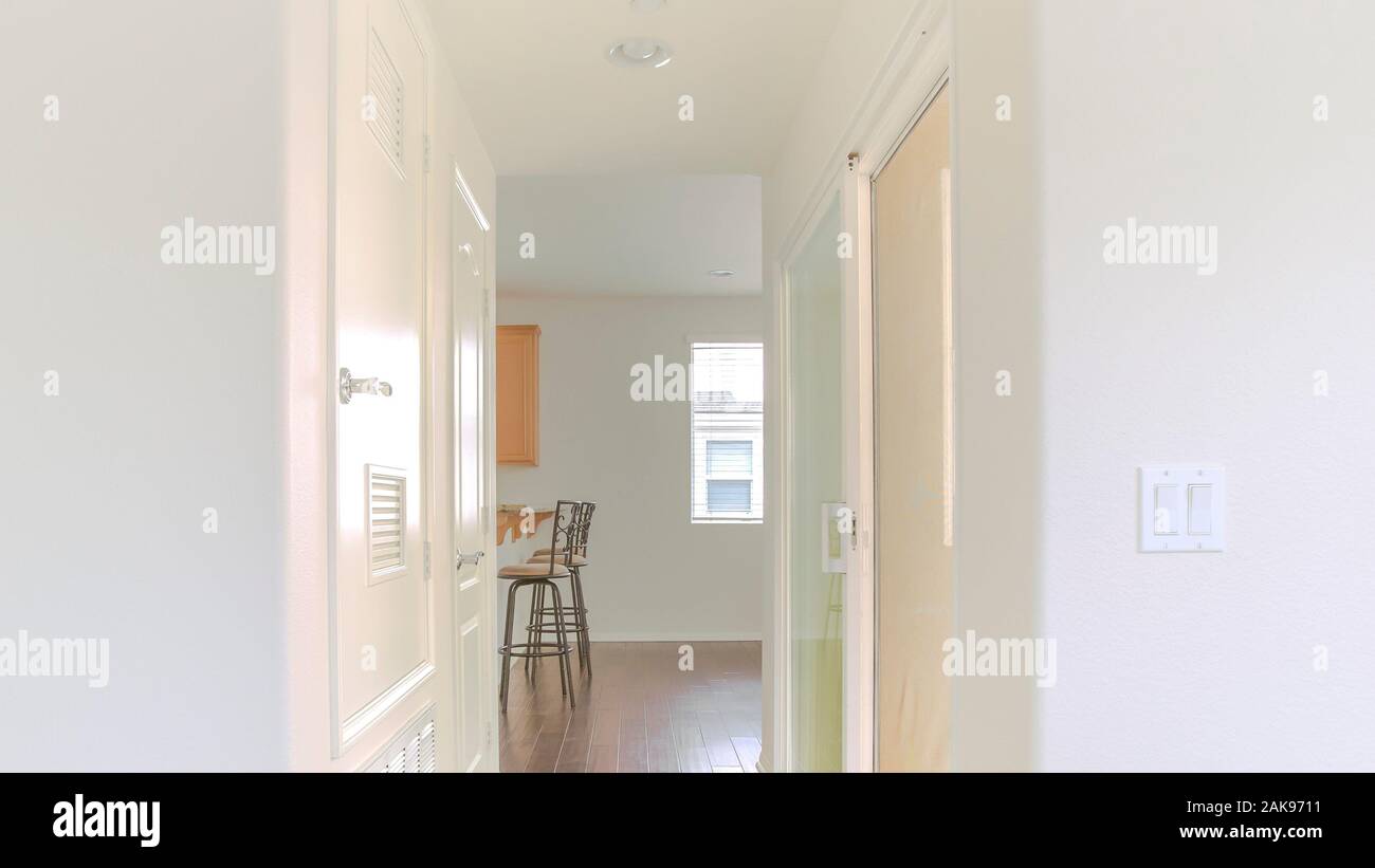 Panorama Hallway to the kitchen from the living room Stock Photo - Alamy