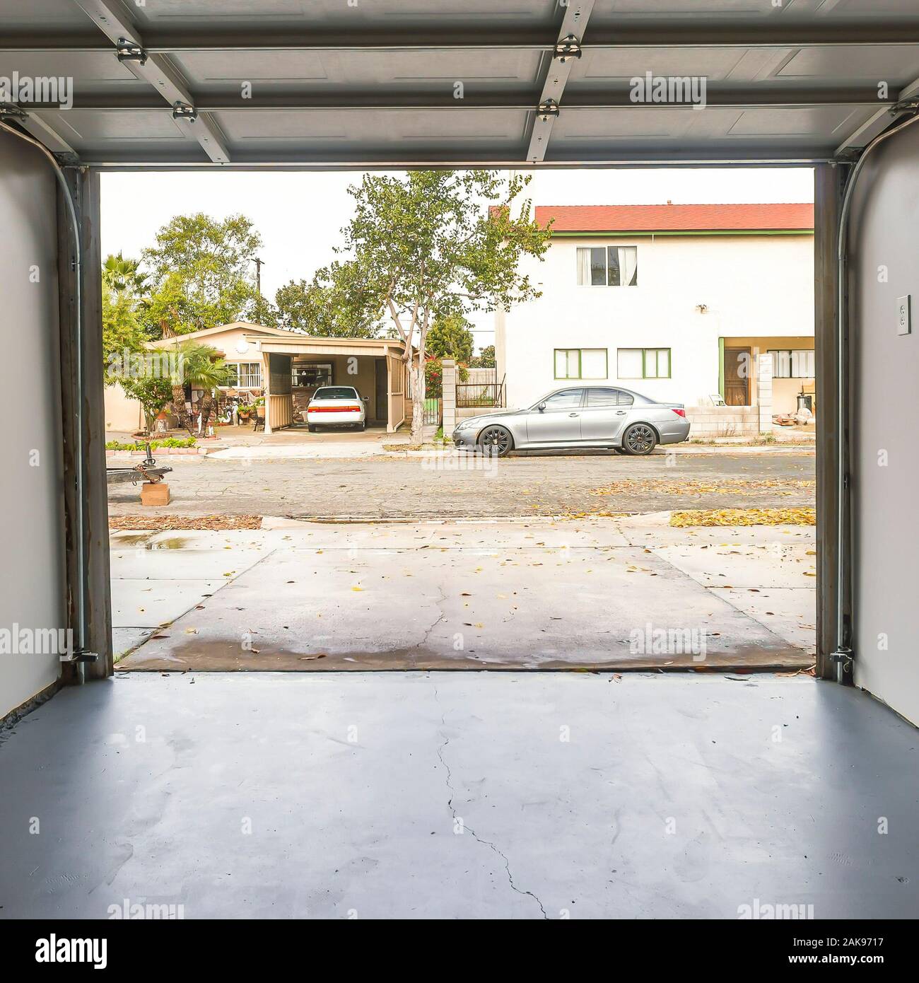 Square Garage door looking out on street Stock Photo - Alamy