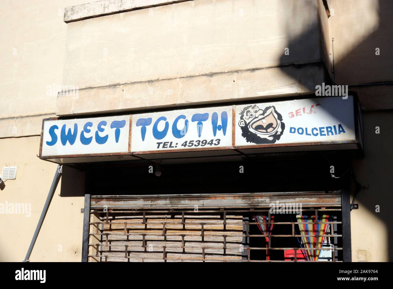 Sweet tooth shop Sign Stock Photo - Alamy