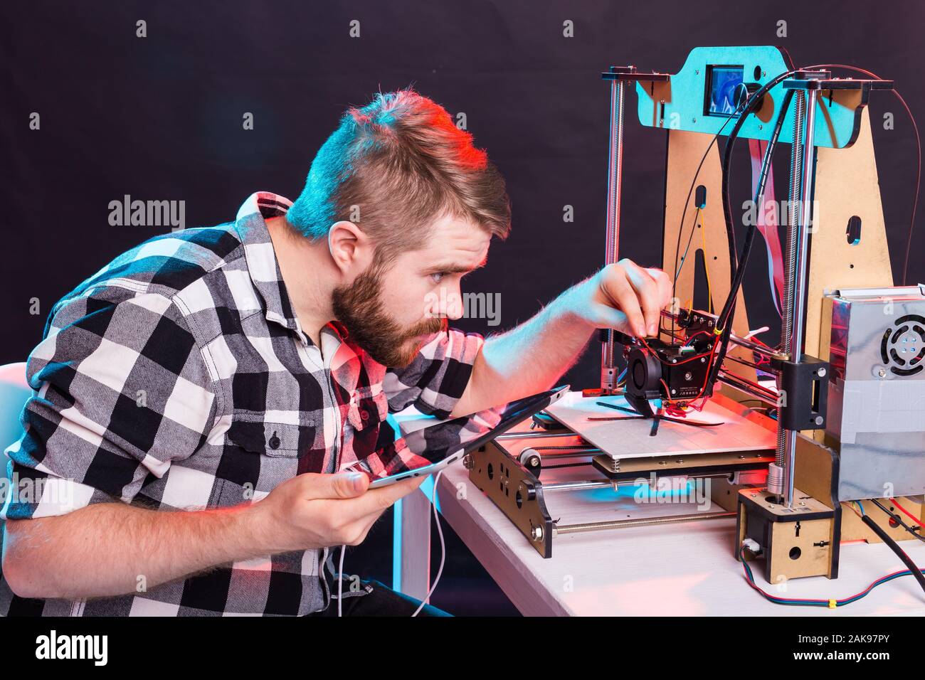 A student man print prototype on 3D printer Stock Photo - Alamy