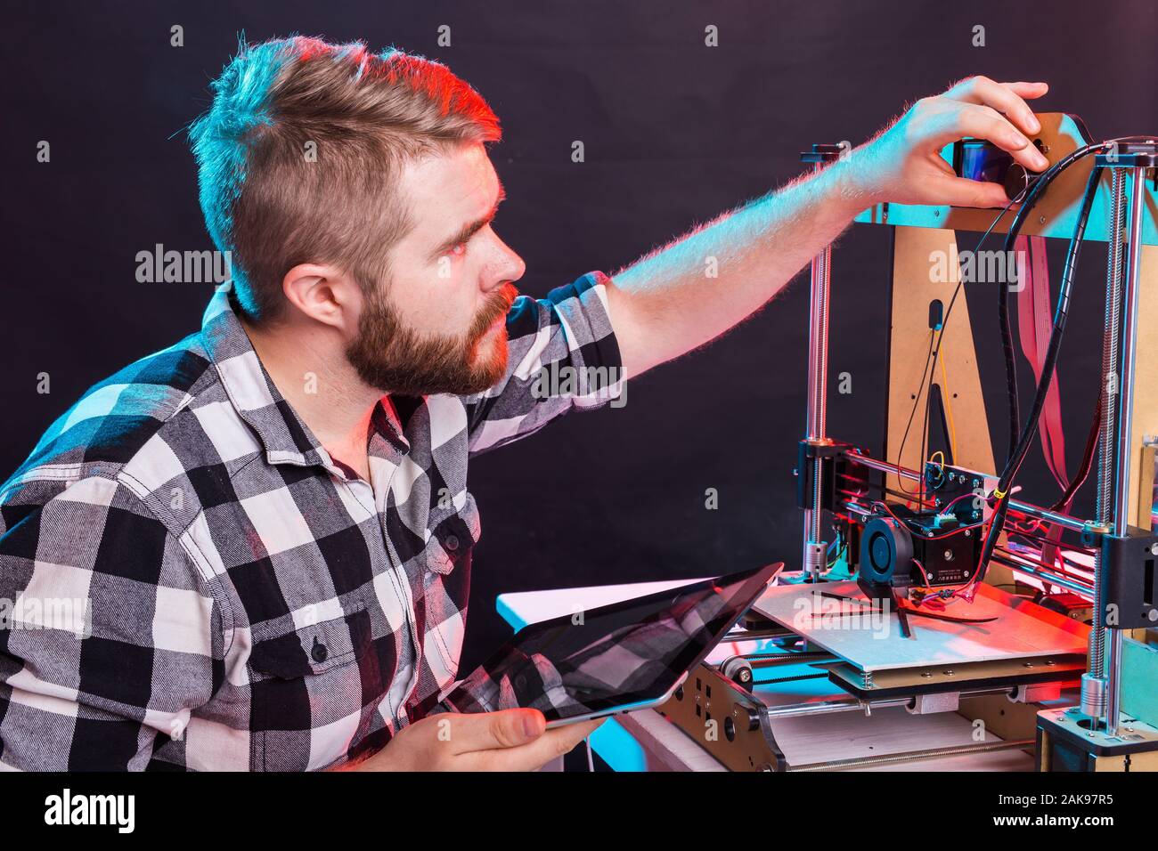 Male architect using 3D printer in office Stock Photo - Alamy