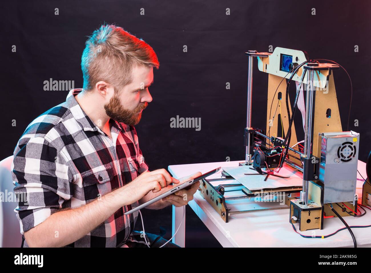 Technology and engineering concept - Male engineer working at night in ...