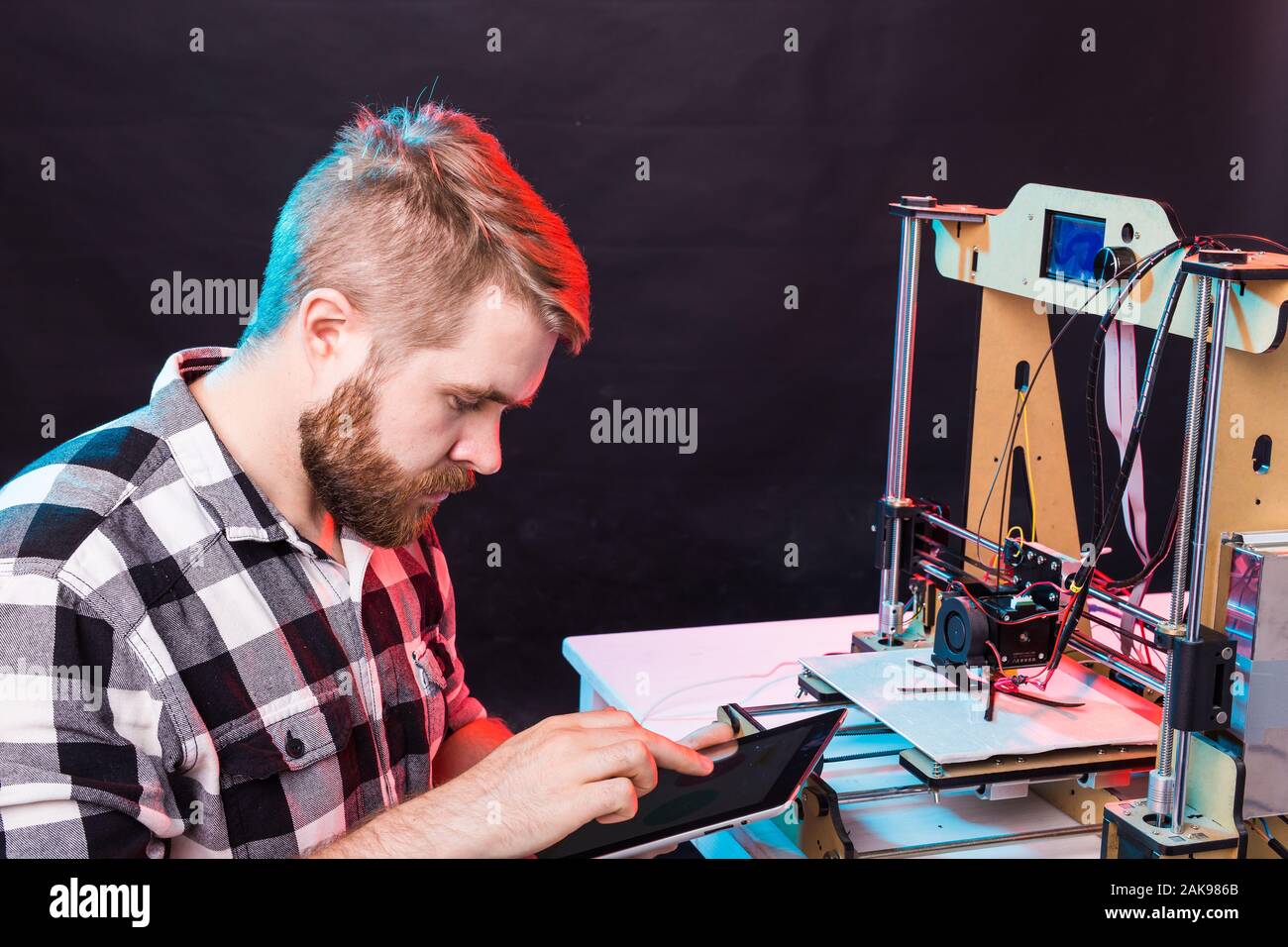 A student man print prototype on 3D printer Stock Photo - Alamy