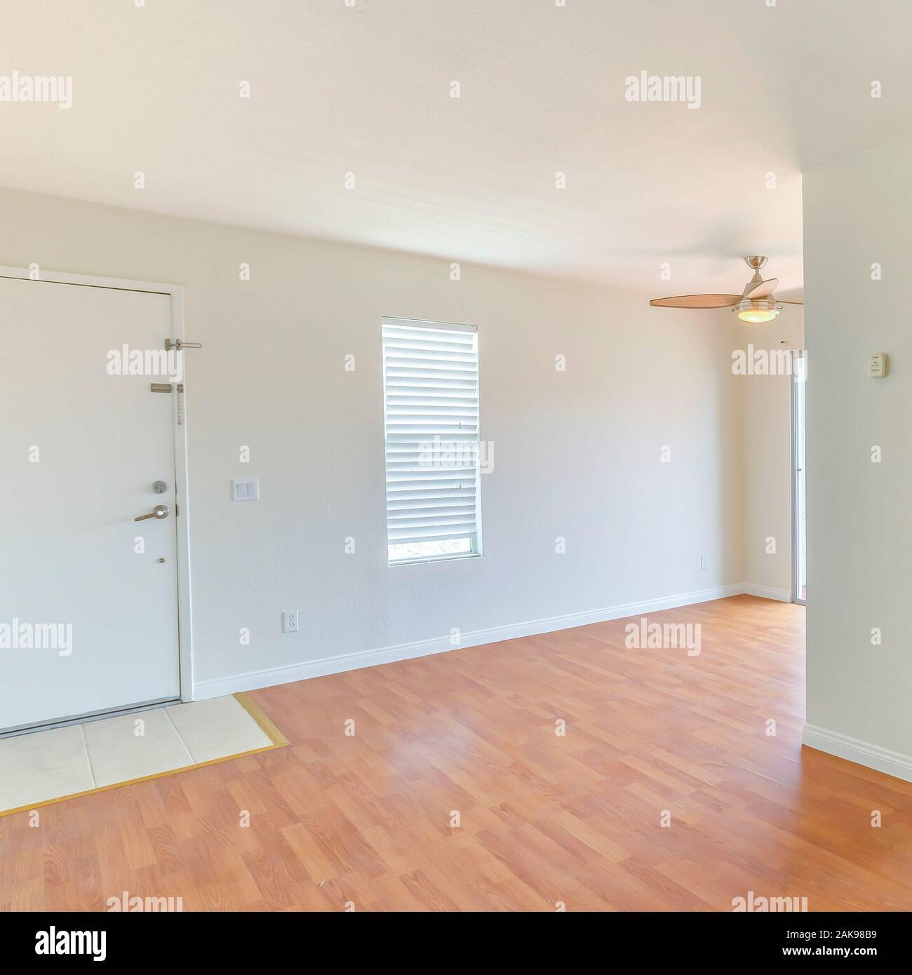 Square frame Empty living room in townhome Stock Photo - Alamy