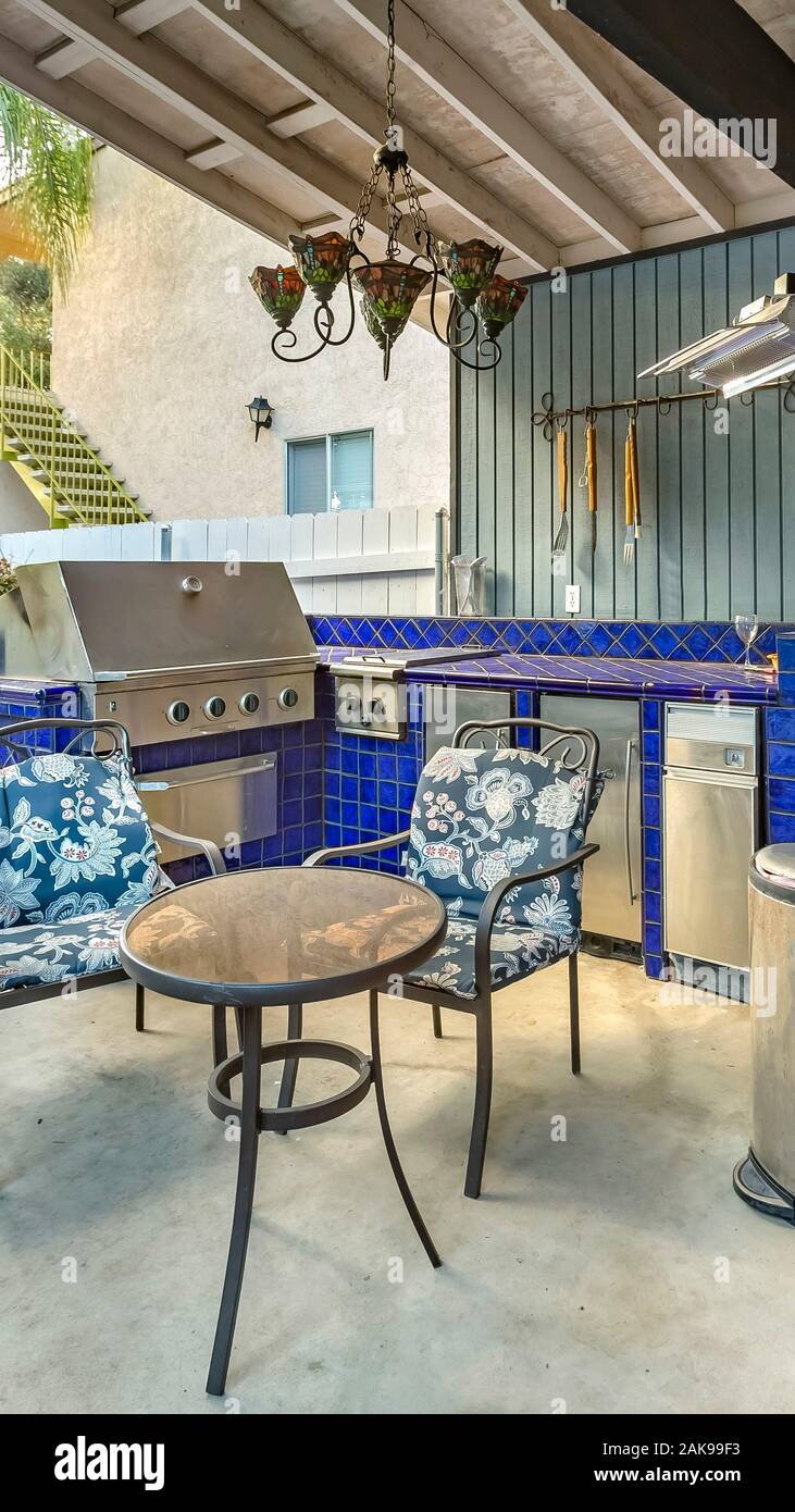 Vertical frame High angle view of a stylish outdoor kitchen on a brick ...