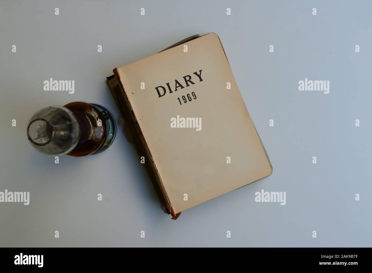 Focus on words DIARY 1969 of vintage diary with damaged spine placed on ...
