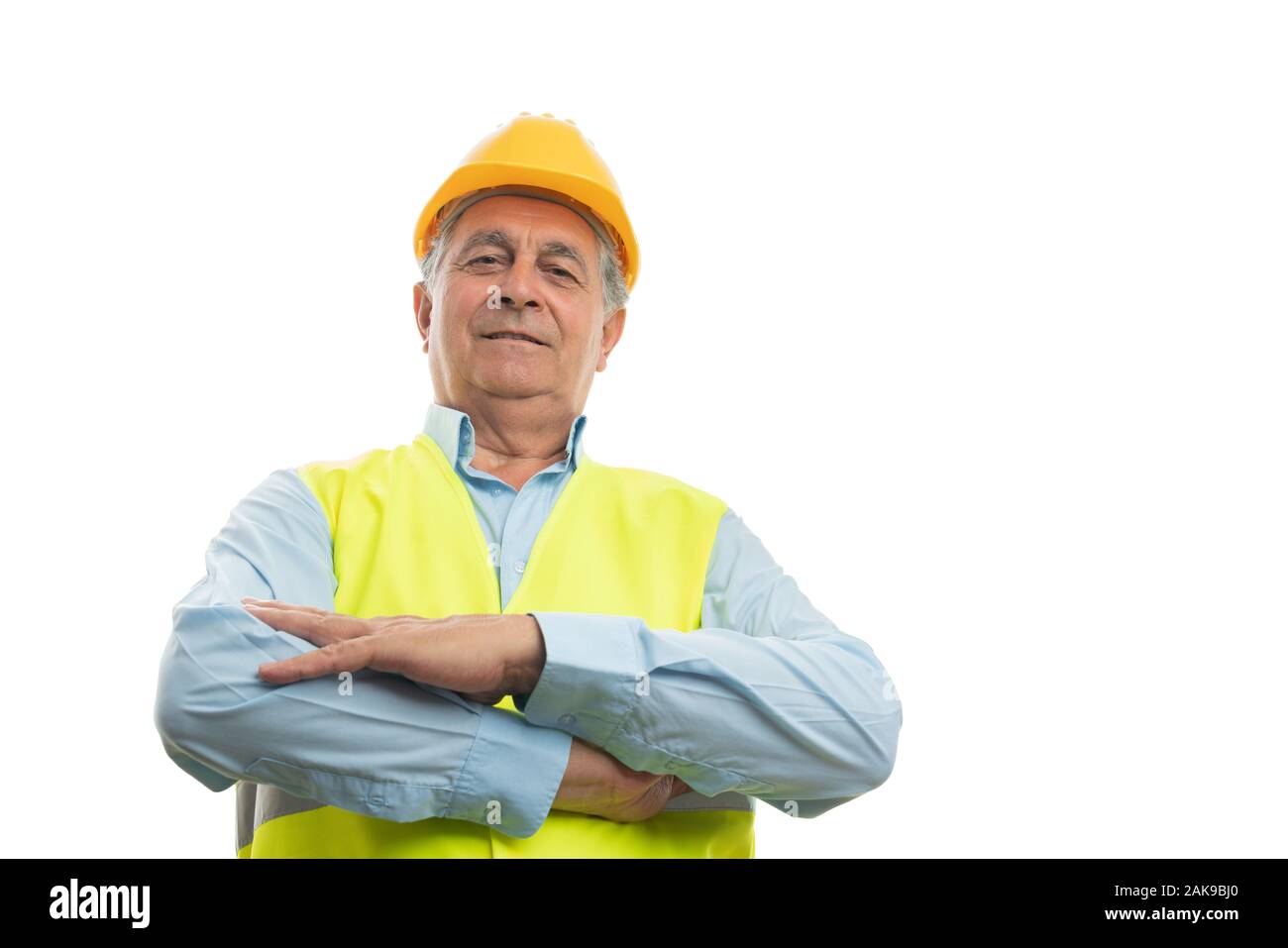 Old builder man portrait from below with arms crossed isolated on white ...