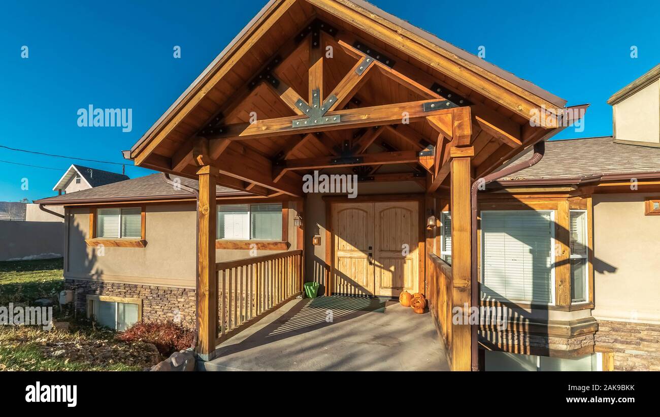 Panorama frame Covered wooden portico leading to a front door Stock ...