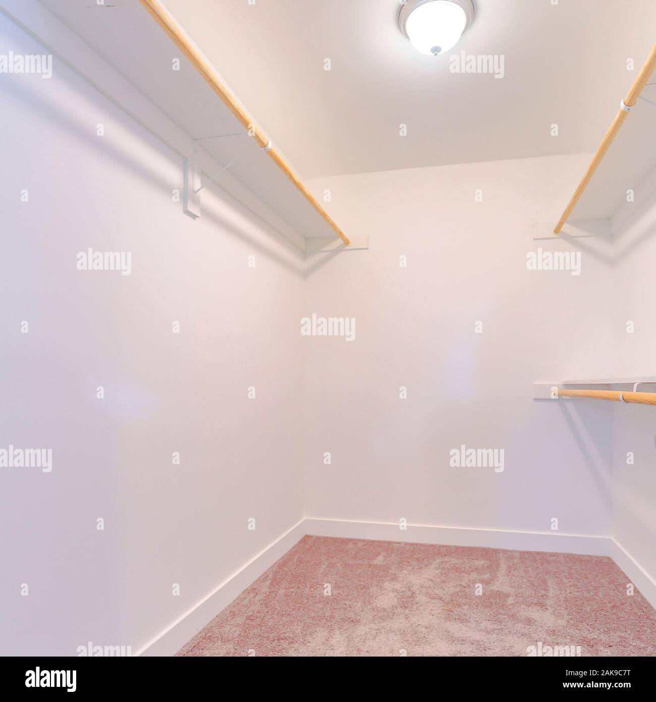 Square Wide walk-in closet in southern California Stock Photo - Alamy