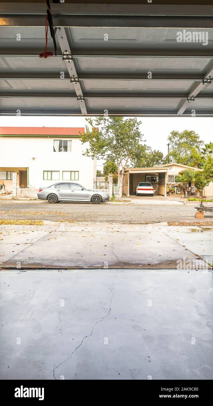 Vertical Garage door looking out on street Stock Photo - Alamy