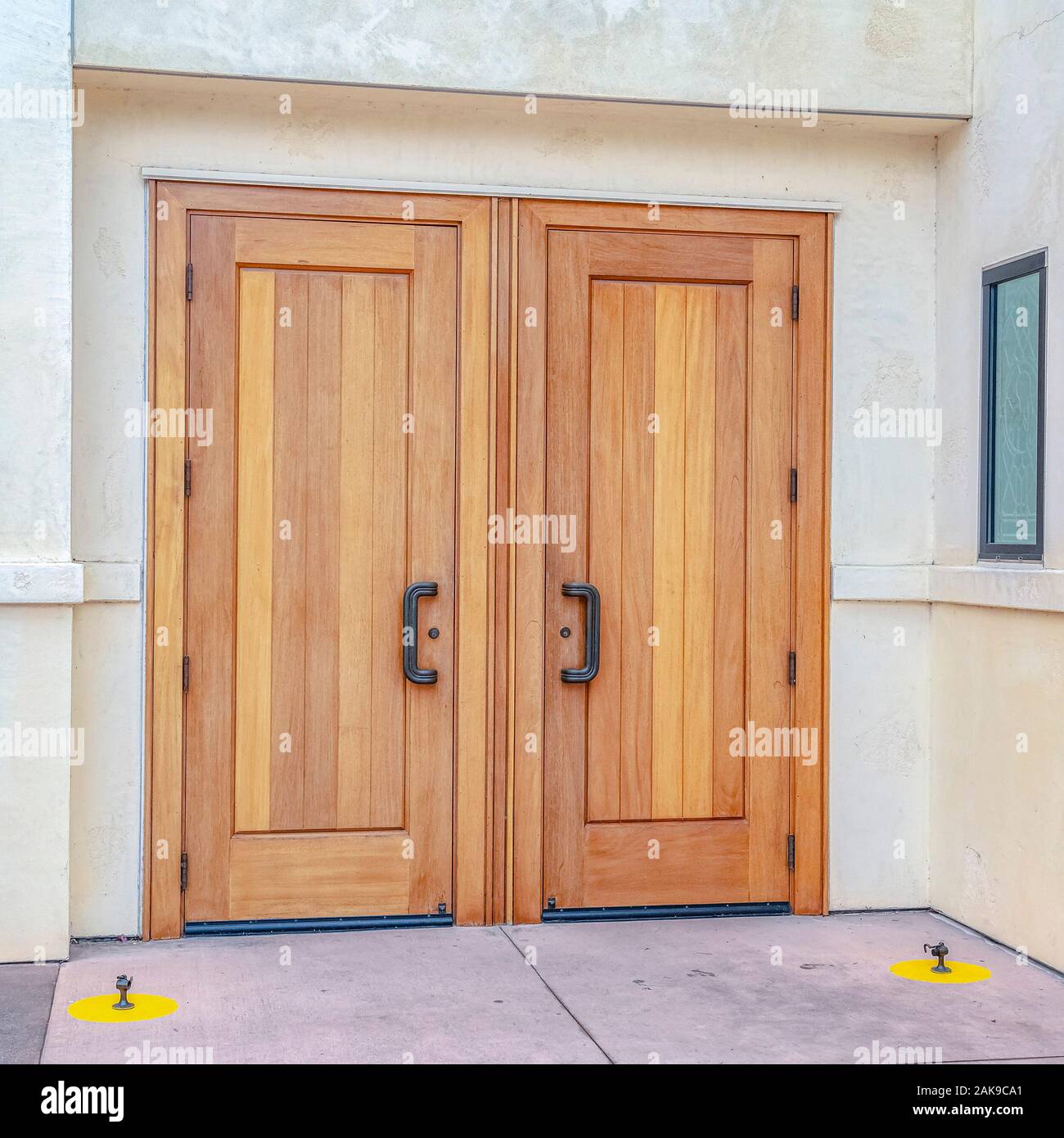 Square Closed double wooden entrance doors on cloudy day Stock Photo ...