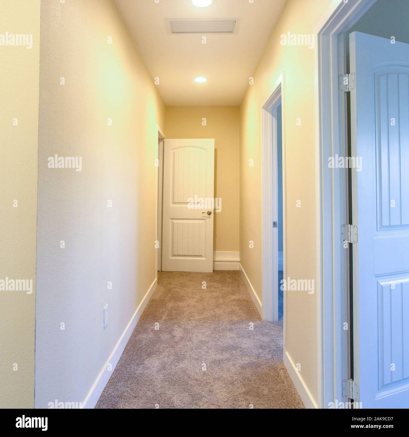 Square frame Carppet in a halway of an empty home Stock Photo - Alamy