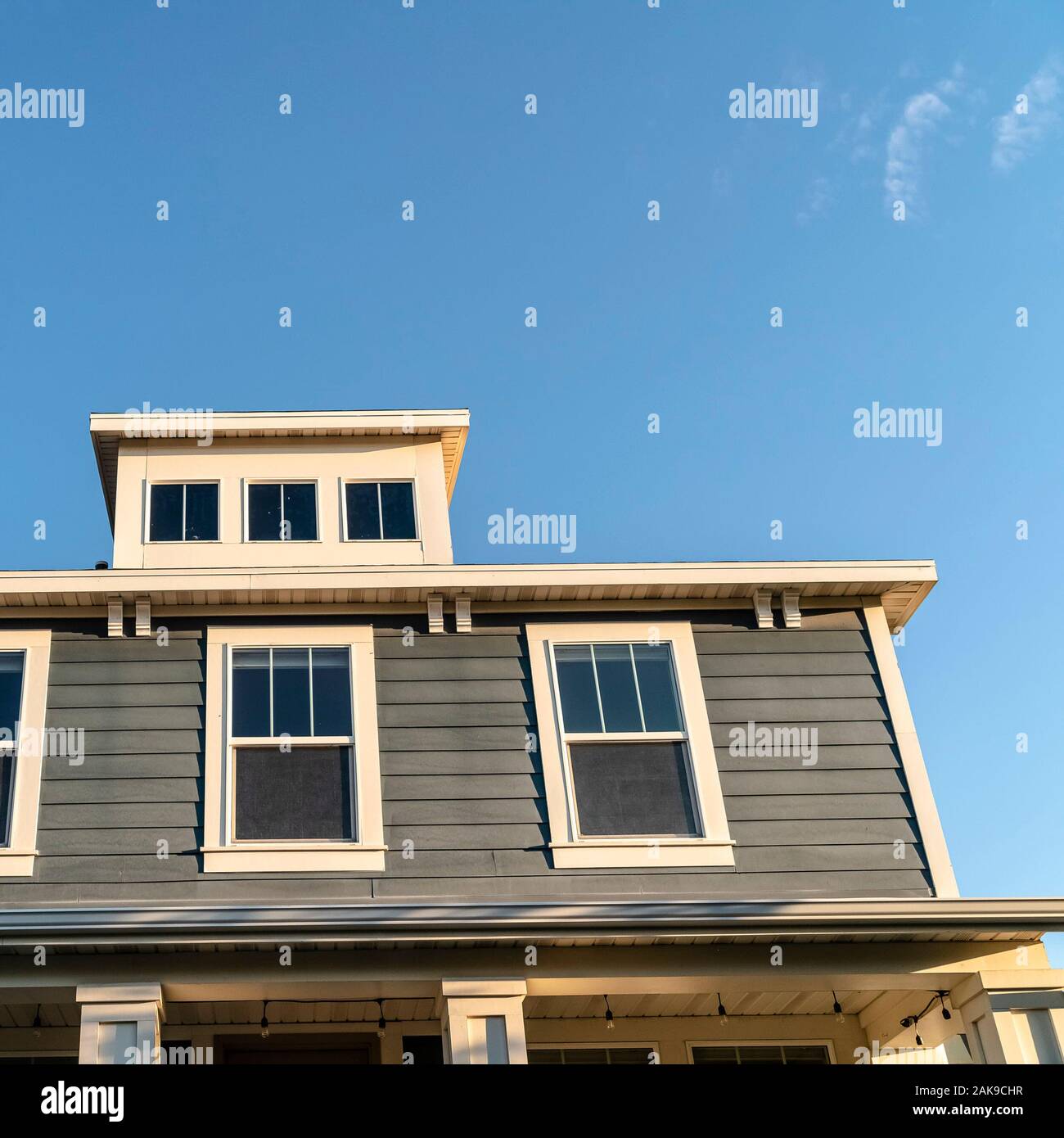 Square frame Grey wooden house with three upper windows Stock Photo - Alamy