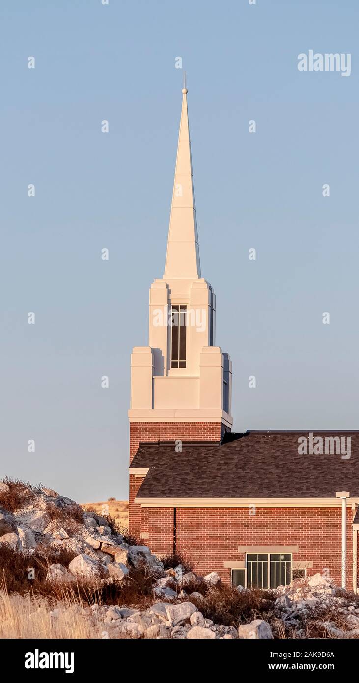 Vertical Small modern church with white steeple near sunrise Stock ...