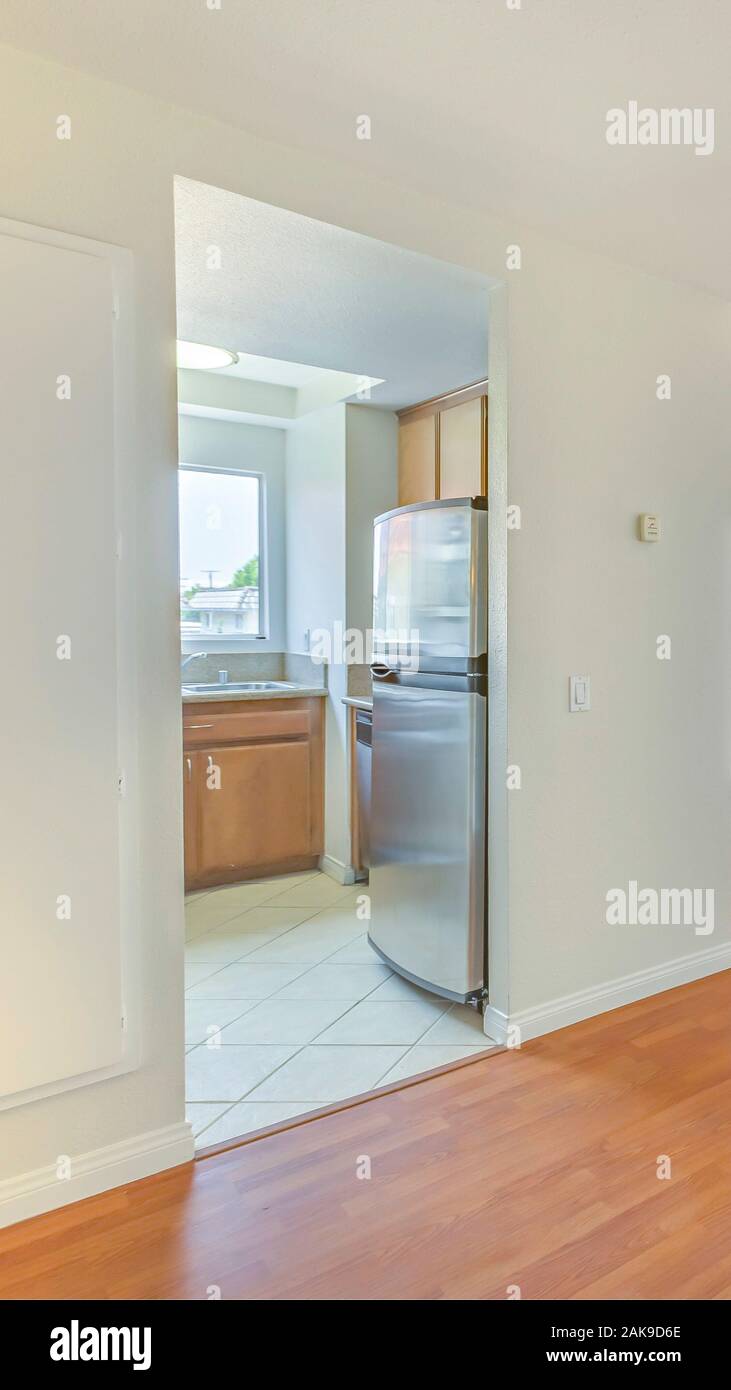 Vertical frame Empty living room in townhome Stock Photo - Alamy