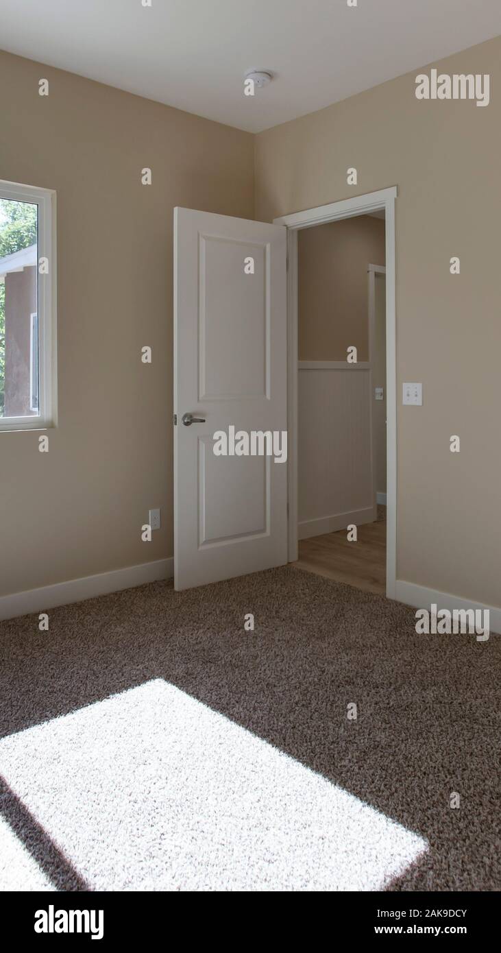 Vertical frame Empty bedroom view of backyard out window Stock Photo ...
