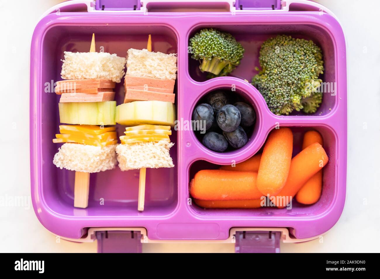 Flat lay. Healthy school lunch with kebab sandwich and vegetables in ...