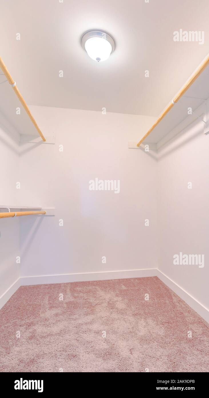 Vertical Wide walk-in closet in southern California Stock Photo - Alamy
