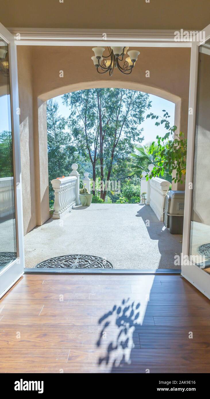 Vertical frame Wide open front door in Fallbrook Stock Photo - Alamy