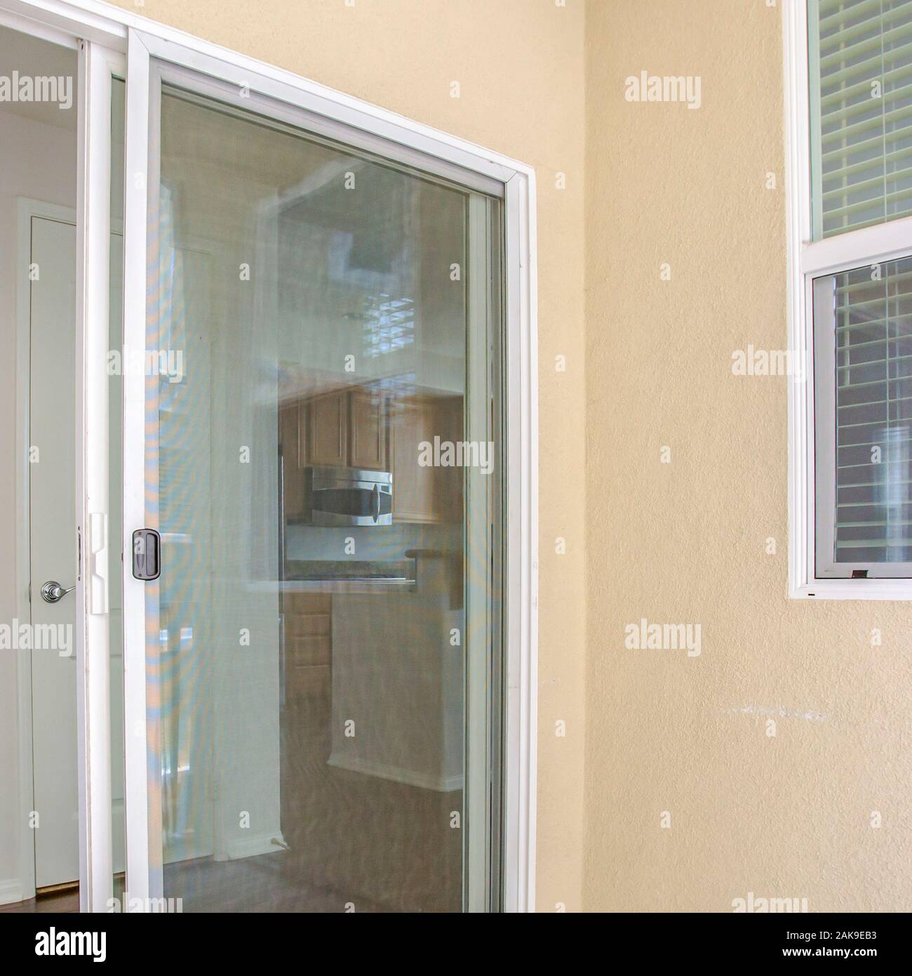 Square frame Sliding glass doors from the patio Stock Photo - Alamy