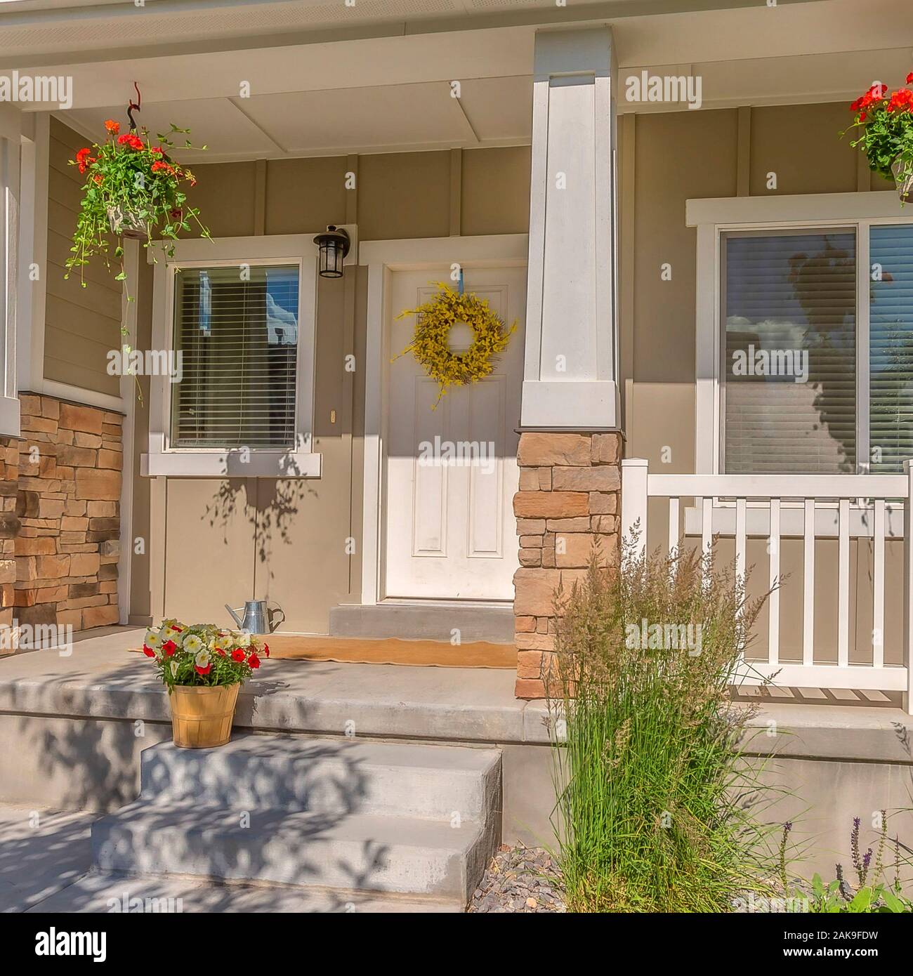 Square Exterior of sunlit home with pathway and stairs leading to porch ...