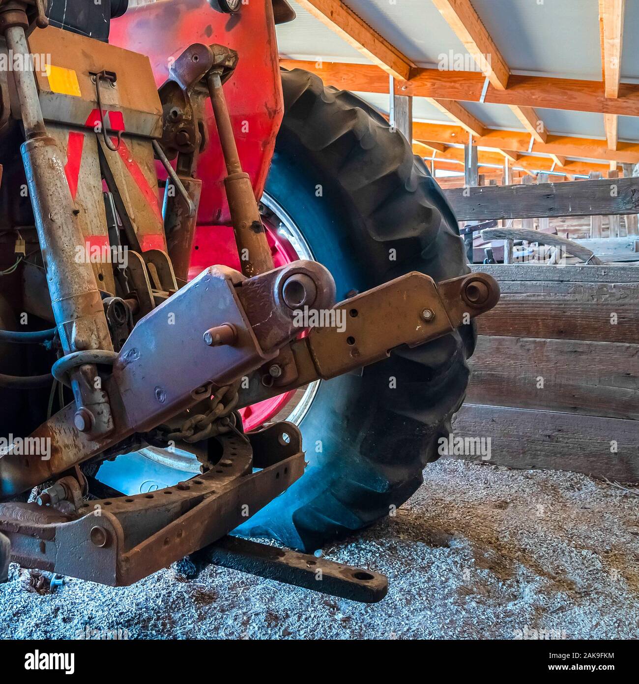Square Back view of an old vintage tractor with black wheels and red ...