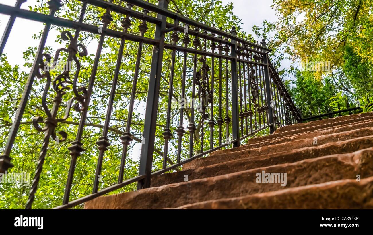 Pano frame Close up of staircase with stone treads and metal railing ...