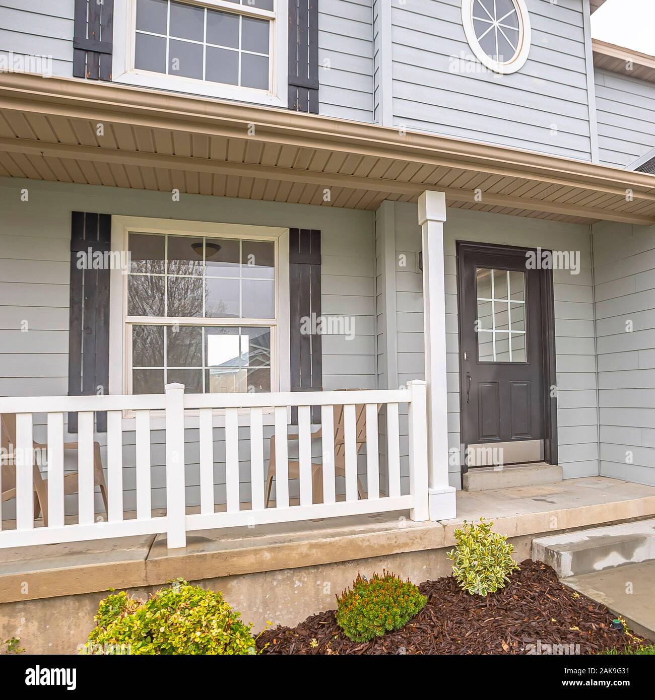 Square frame Home with front porch glass panels on door and windows ...