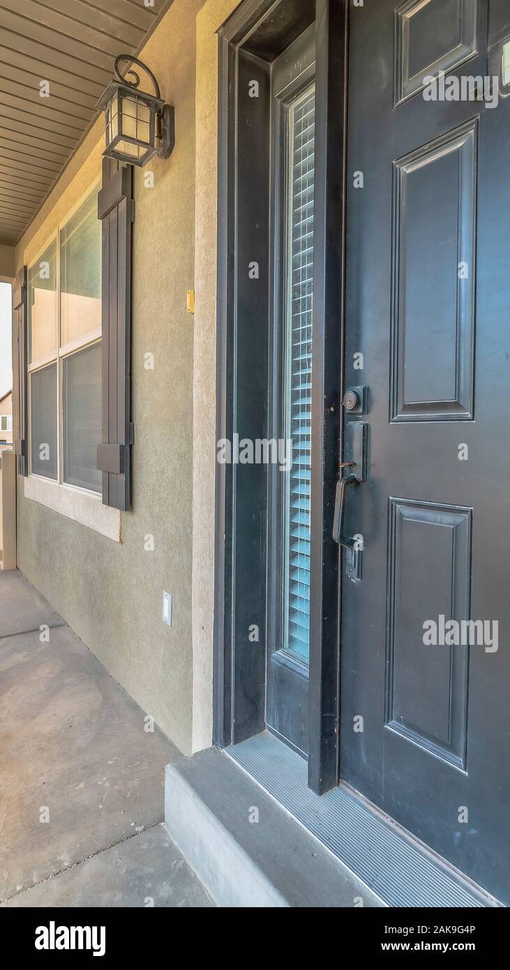 Vertical Home exterior view with gray front door sidelight and front ...
