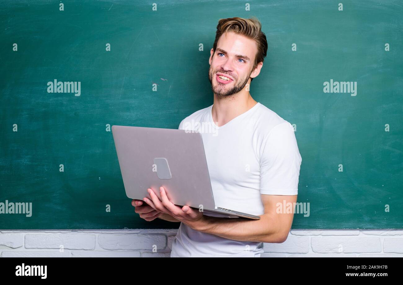 Student learn digital world. School teacher with laptop. Handsome man ...